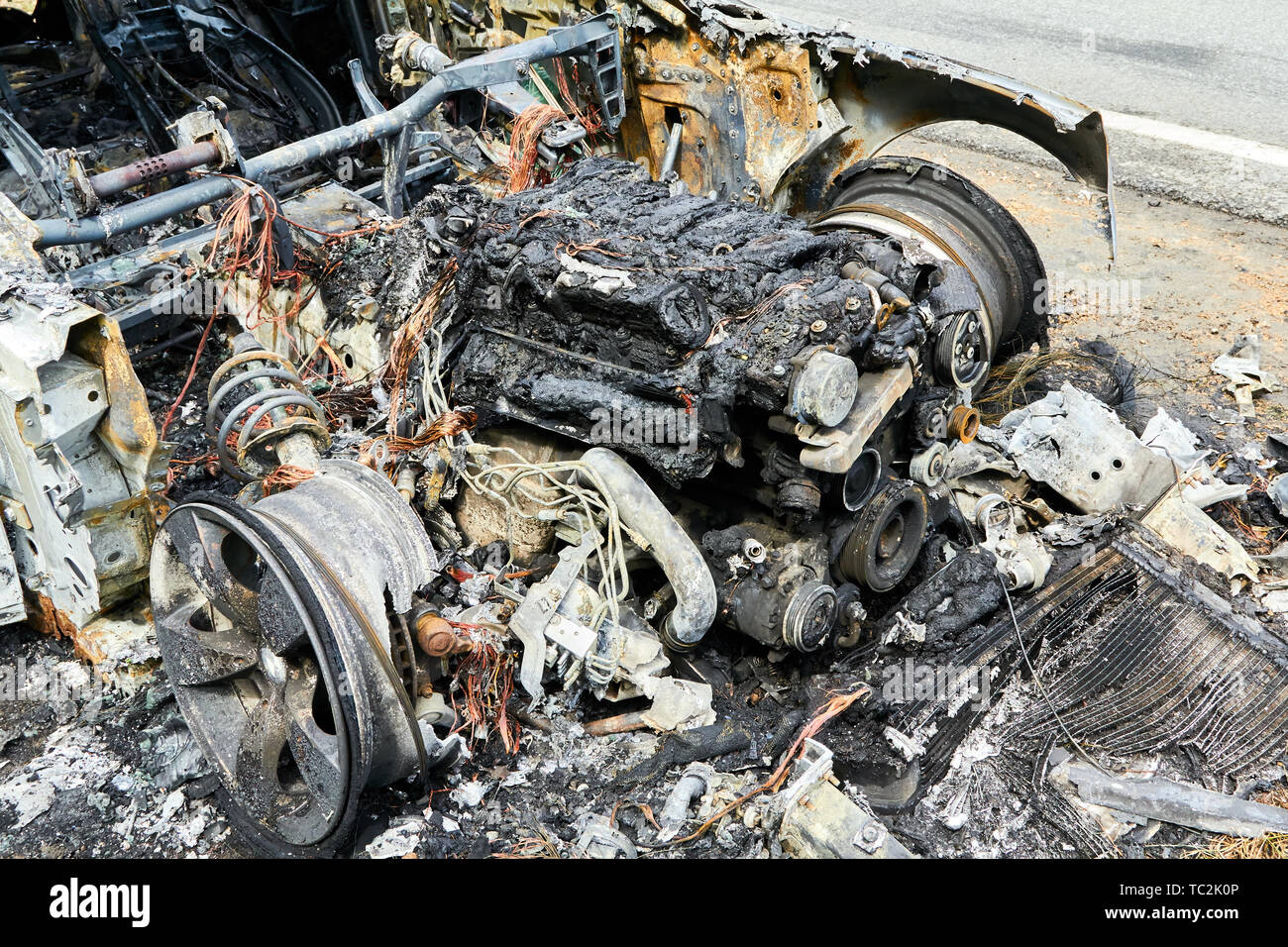 Fully burned car after collision with truck in summer, accident ...