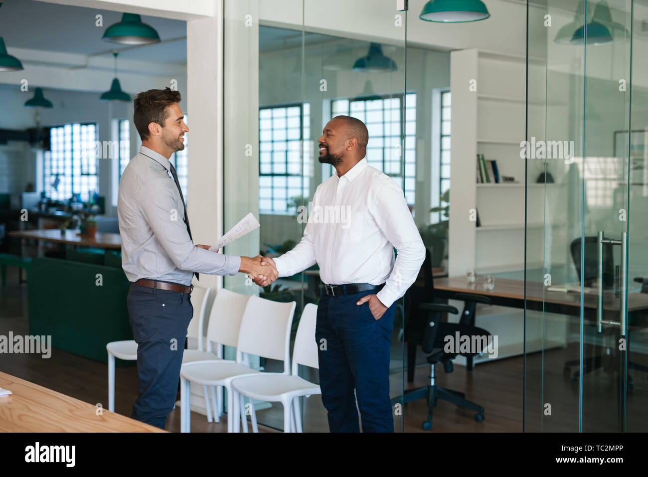 Interview handshake ethnic hi-res stock photography and images - Alamy