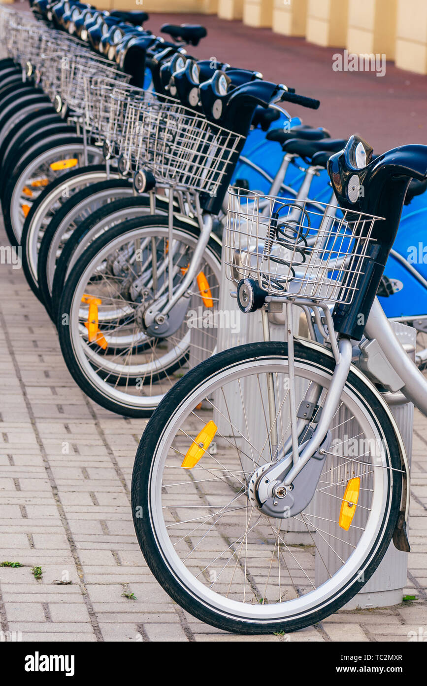 Row blue rental bicycles hi-res stock photography and images - Alamy