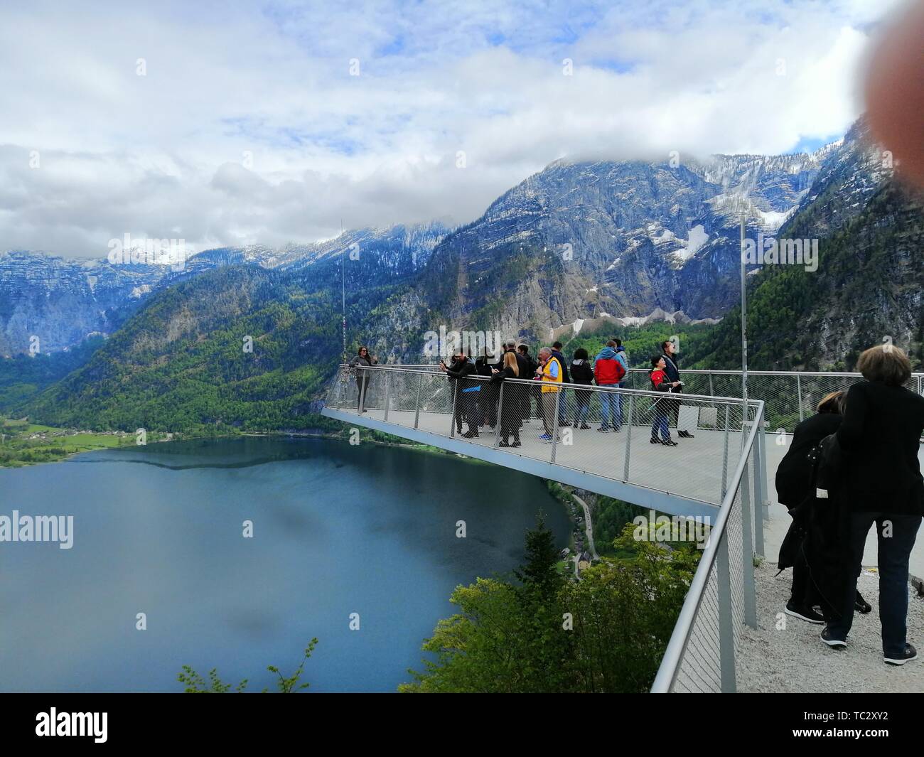 Hallstatt, Austria. 16th May, 2019. Tourists stand on a viewing ...