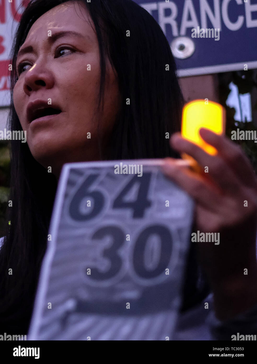 Los Angeles, USA. 4th June, 2019. Protestors hold candles and sing ...