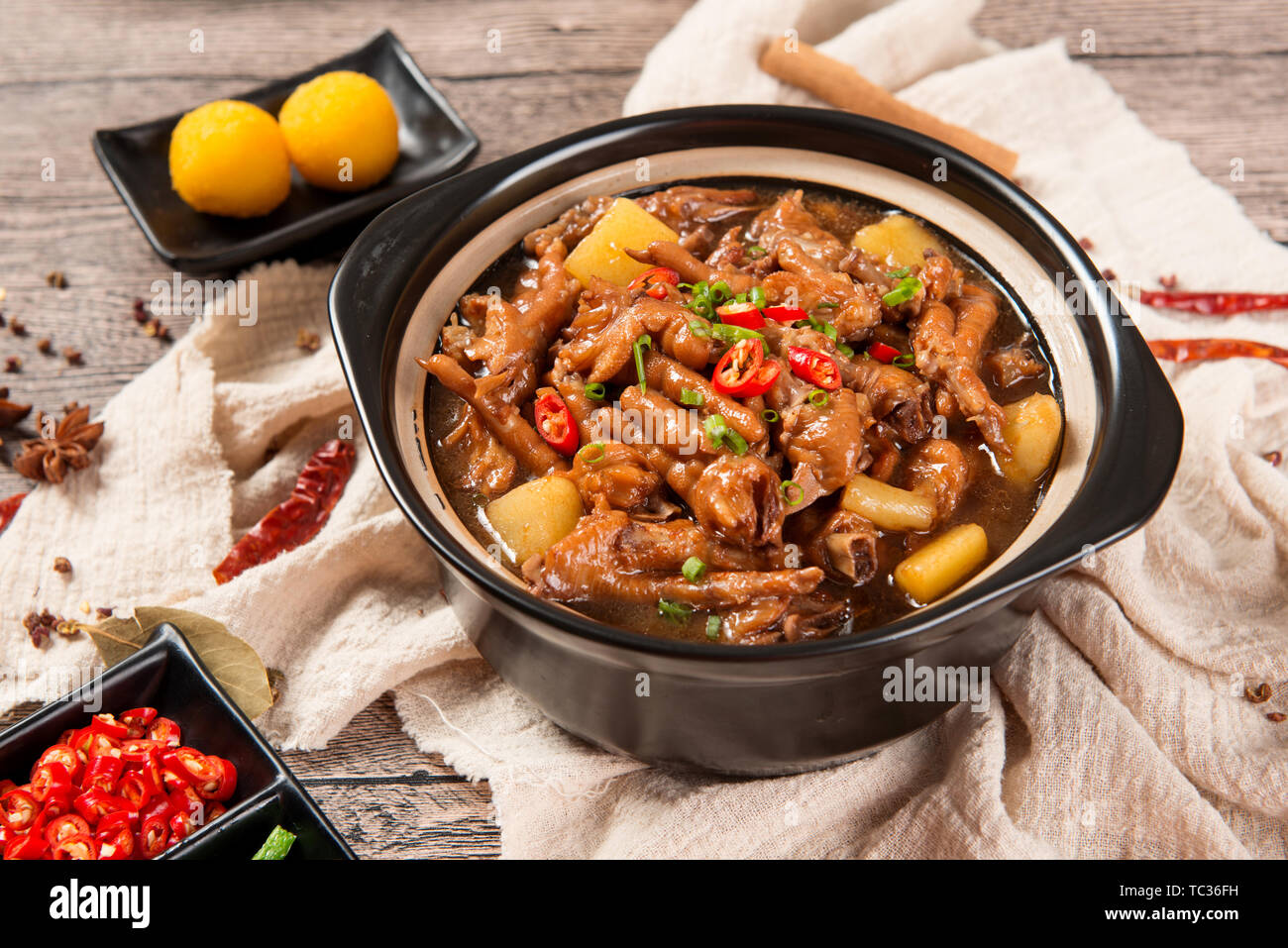 Spicy chicken claw cooker Stock Photo - Alamy