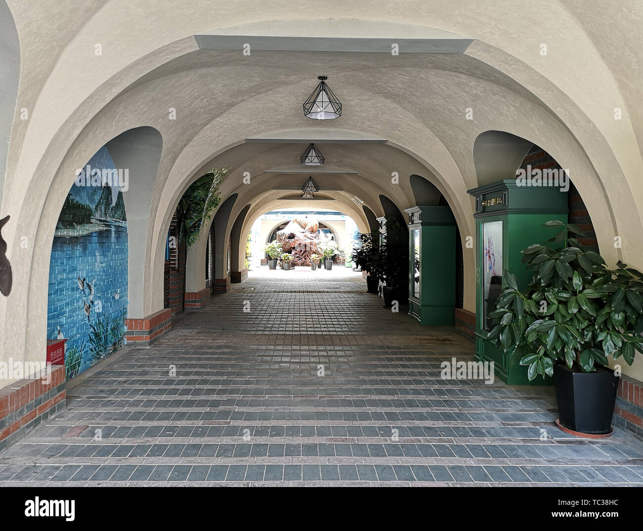 Indoor arched corridor Stock Photo - Alamy