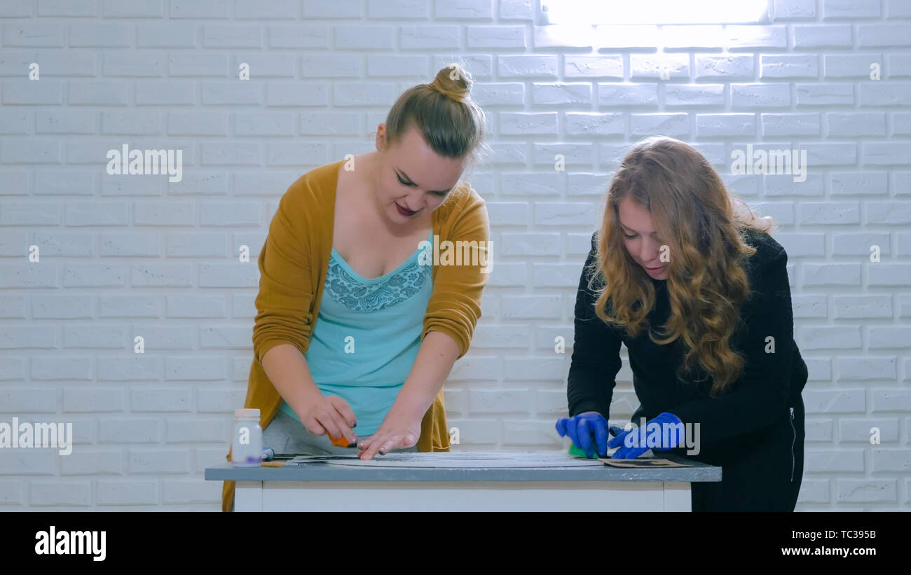 Women decorators hi-res stock photography and images - Alamy