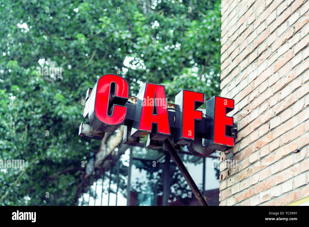 Red word of cafe on brick wall Stock Photo - Alamy