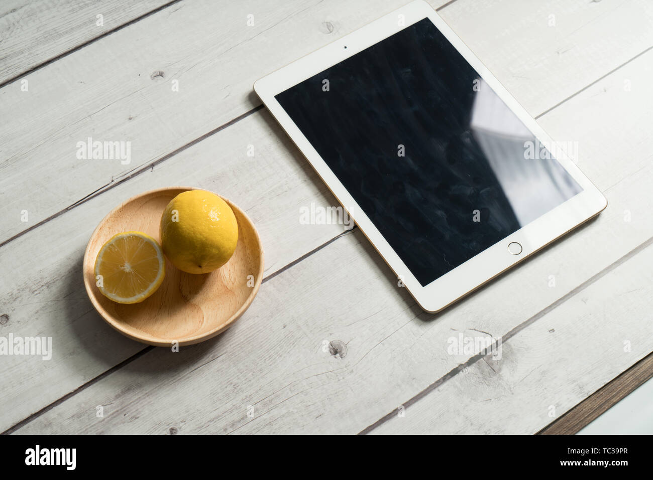 Lemon with tablet Stock Photo - Alamy