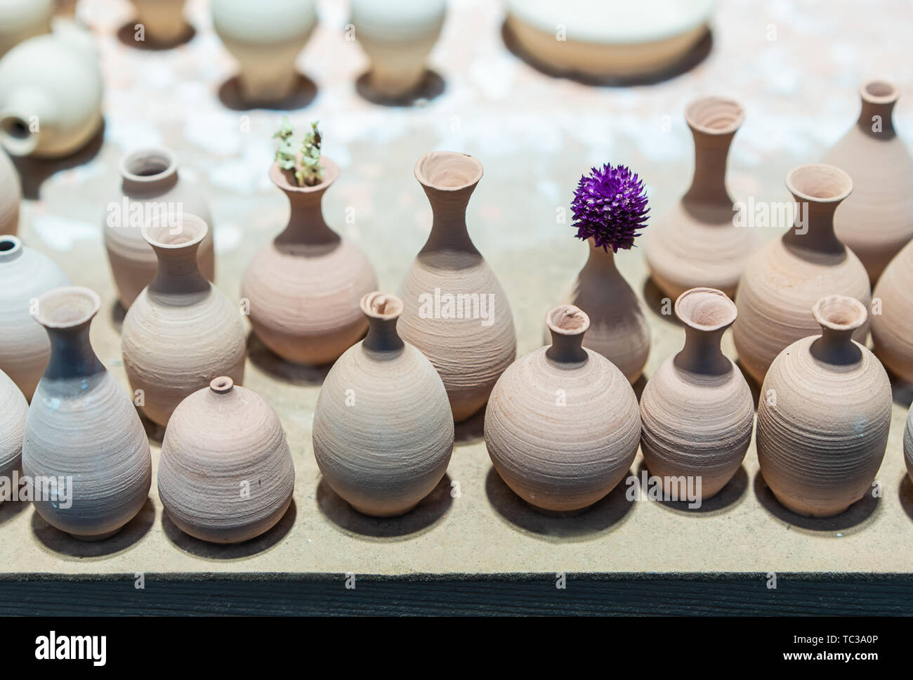 Handmade pottery pots on the table Stock Photo - Alamy
