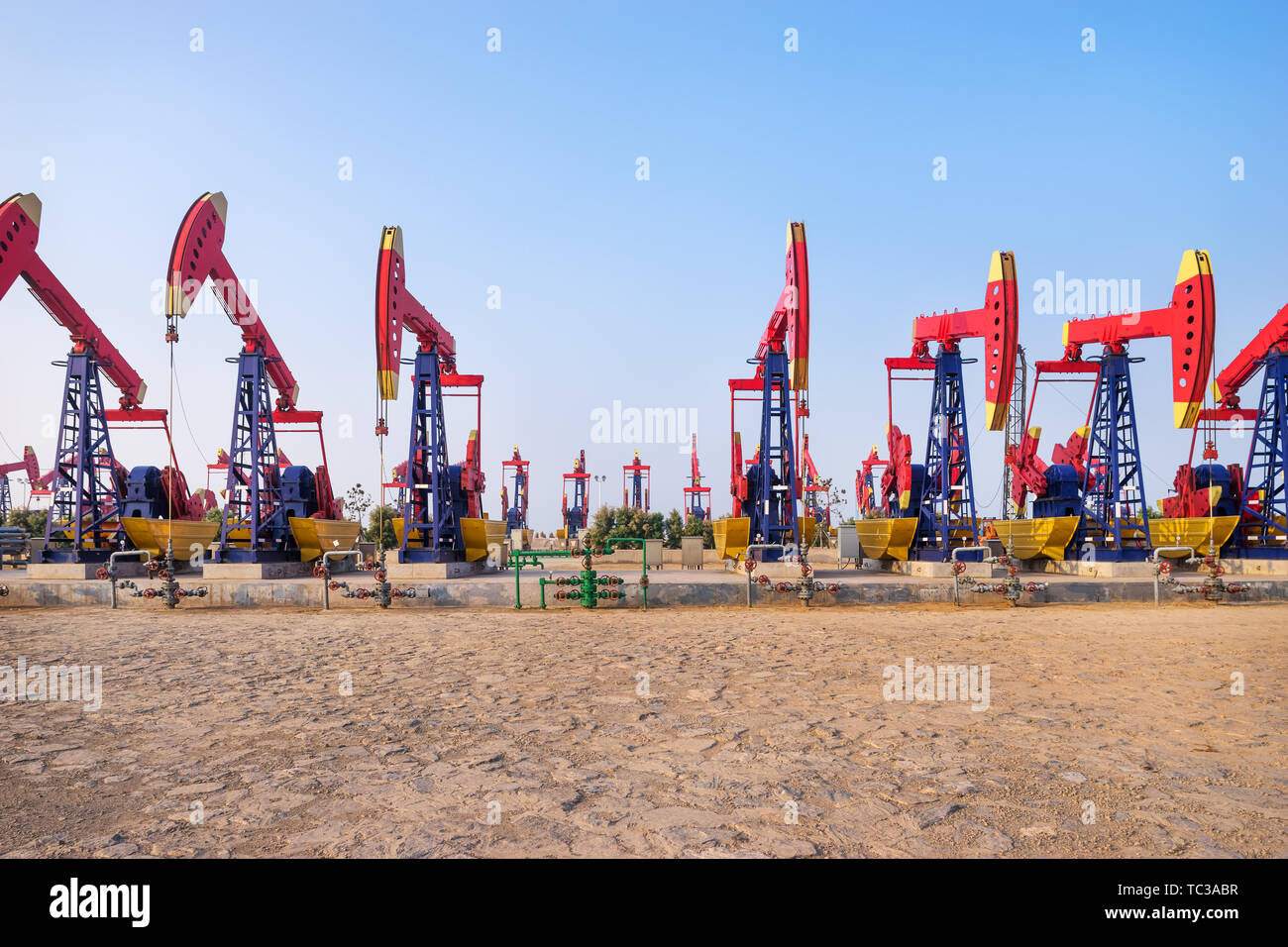 Oil-rig of oilfield day and night Stock Photo - Alamy