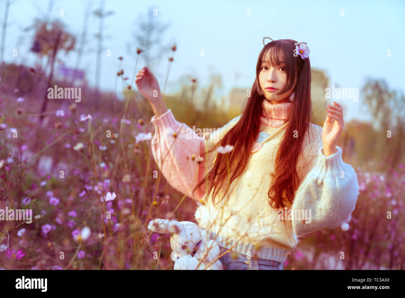Girl surrounded by flowers hi-res stock photography and images - Alamy
