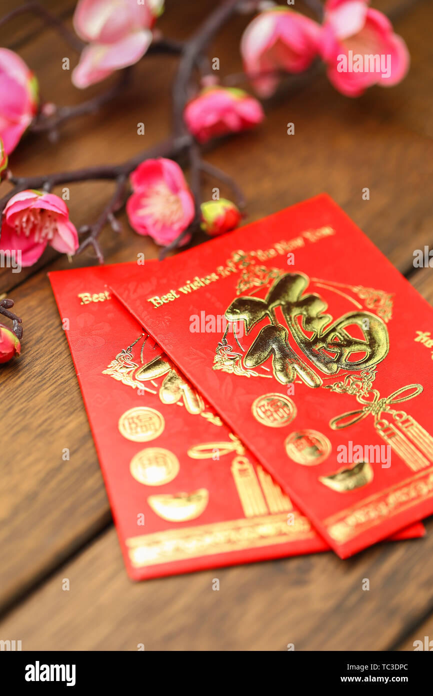 Spring Festival red envelopes on wooden table Stock Photo - Alamy
