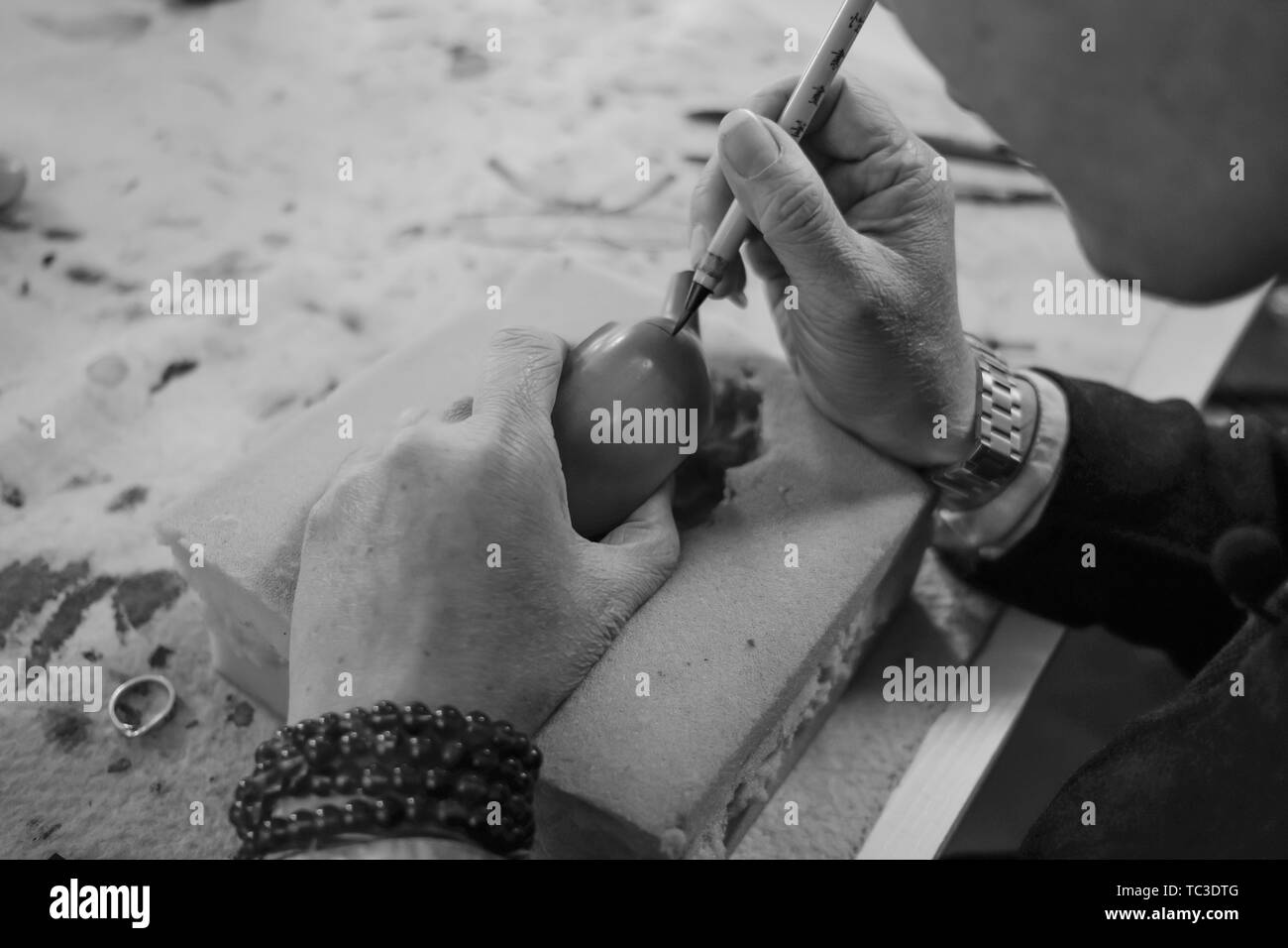 Making purple sand pots Stock Photo - Alamy