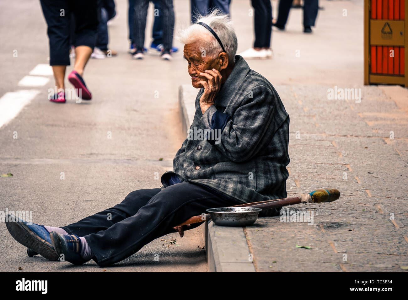The old lady begging on the street Stock Photo - Alamy