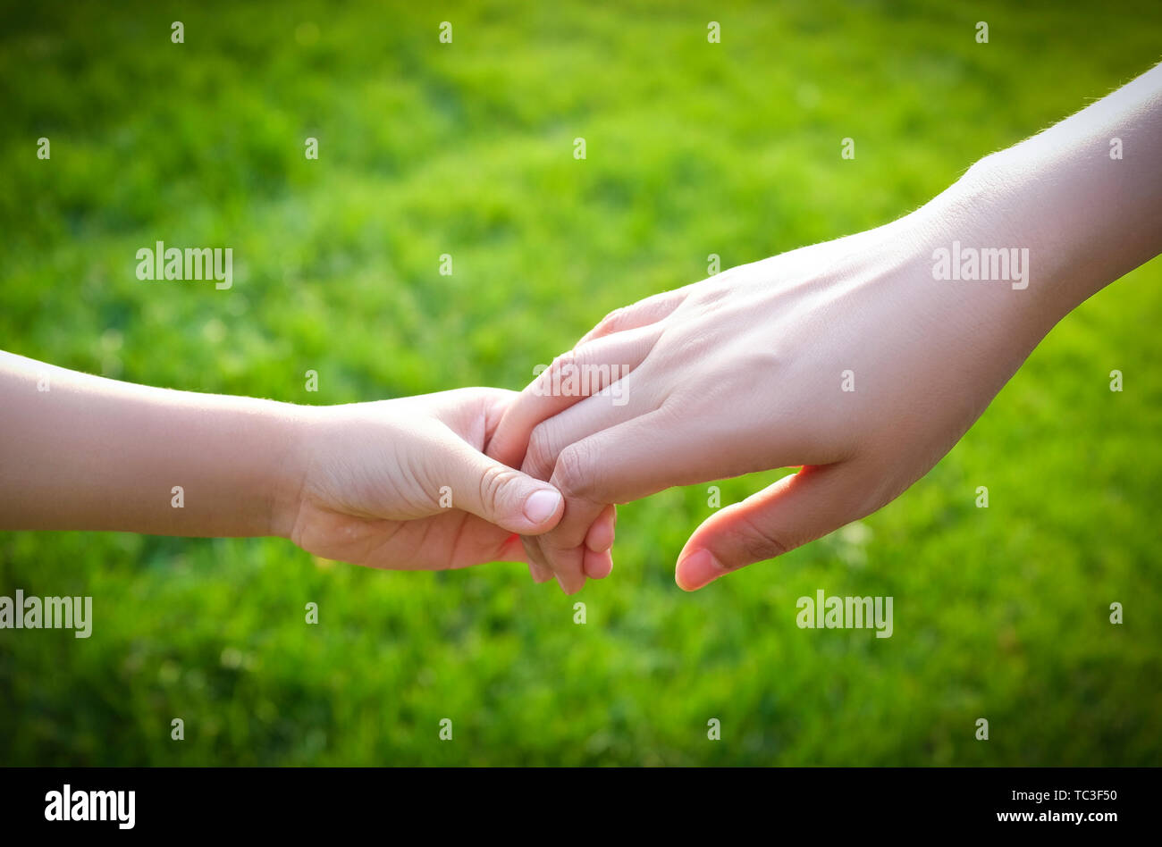 Hand in hand Stock Photo - Alamy