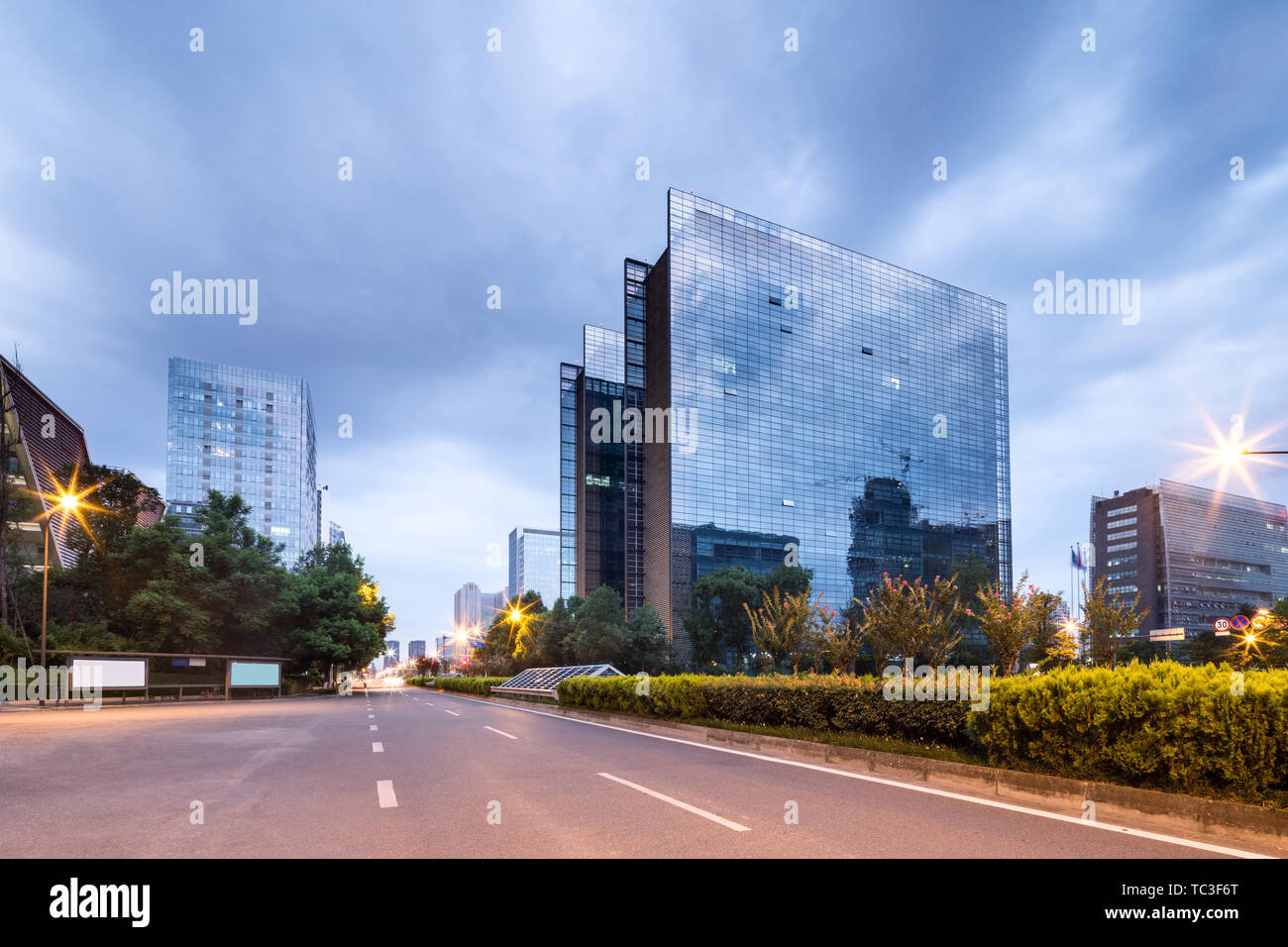 Empty urban roads and modern skyline Stock Photo - Alamy