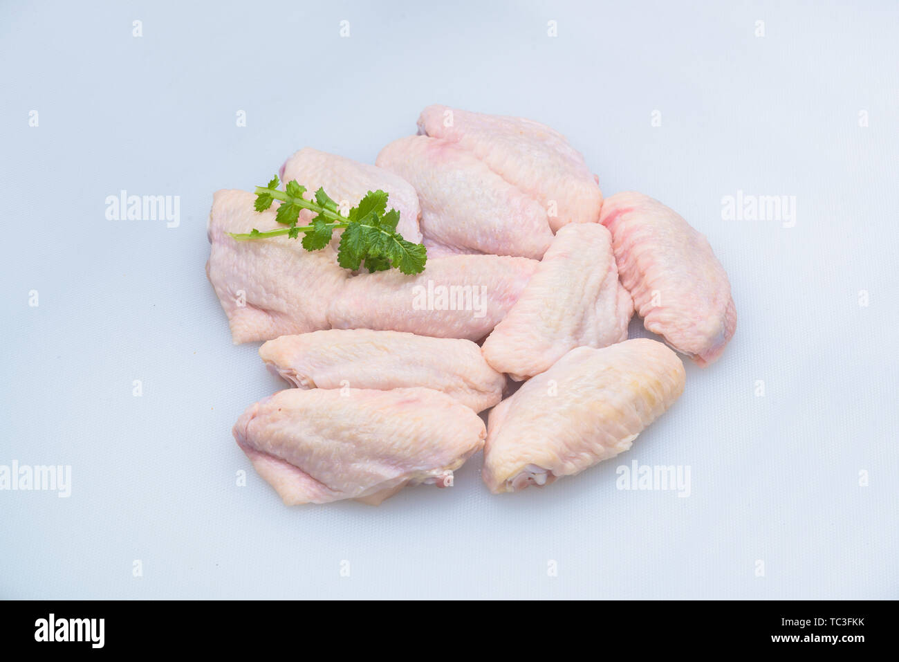 Chicken middle wings on a white background, fresh food Stock Photo - Alamy