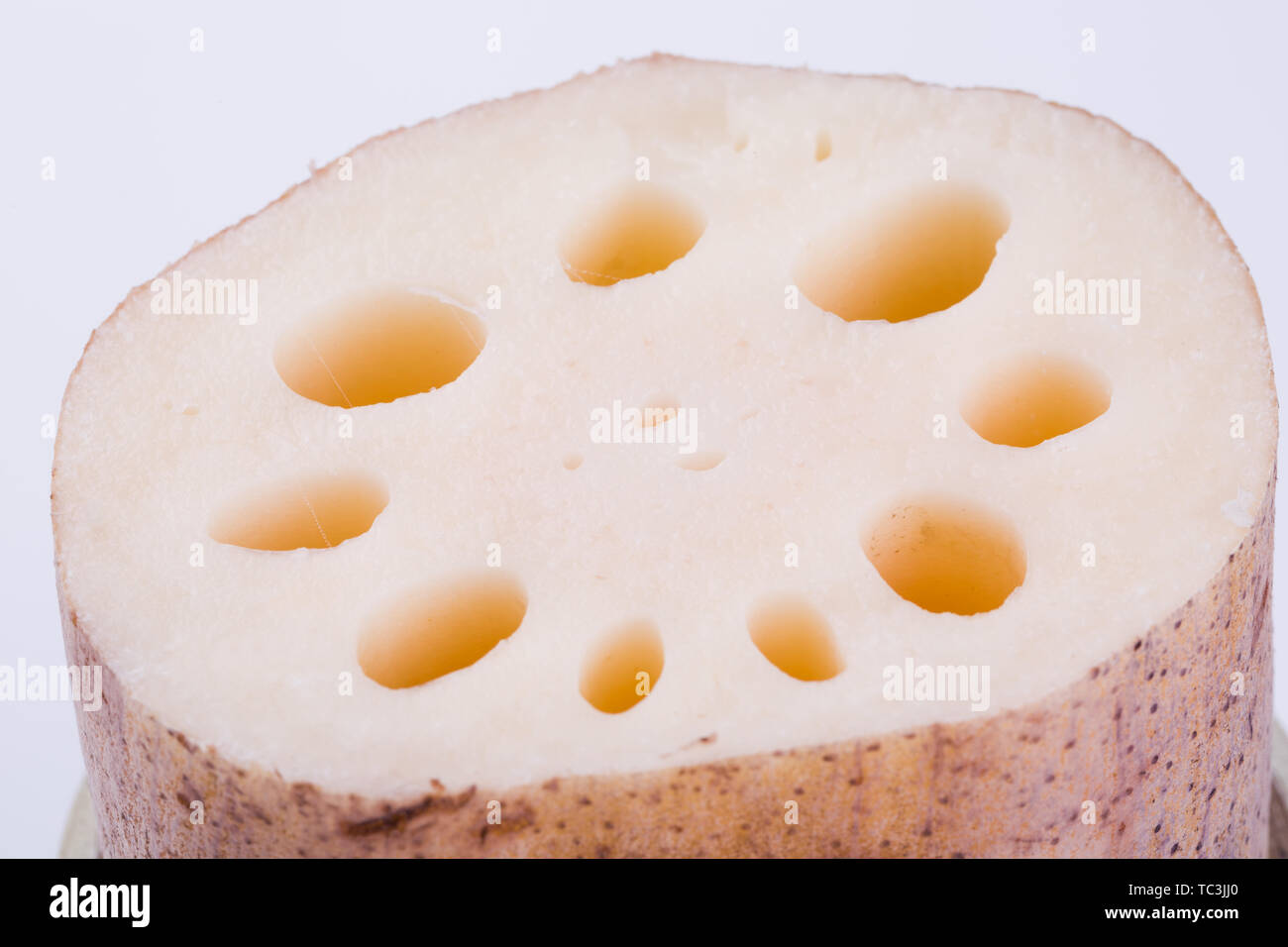 Fresh lotus root on white background Stock Photo - Alamy