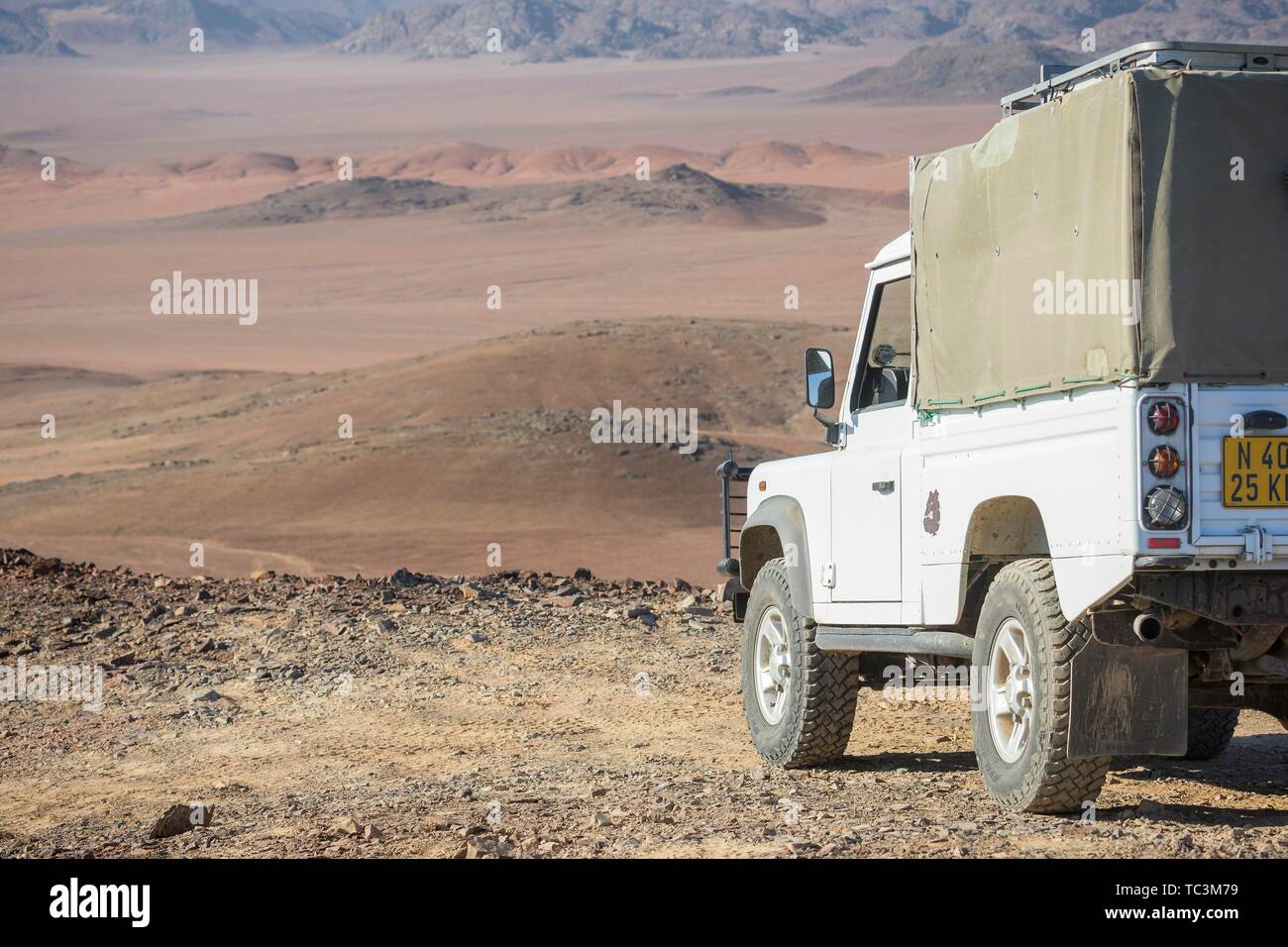 4x4 vehicle on a small hill, desert landscape, Kaokoveld, Namibia Stock ...