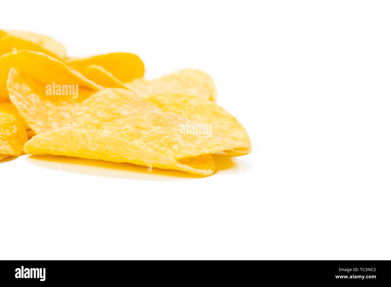 yellow potato chips isolated on white Stock Photo - Alamy