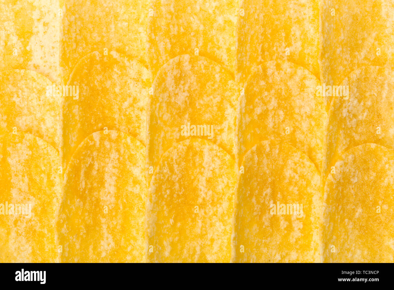 yellow potato chips isolated on white Stock Photo - Alamy