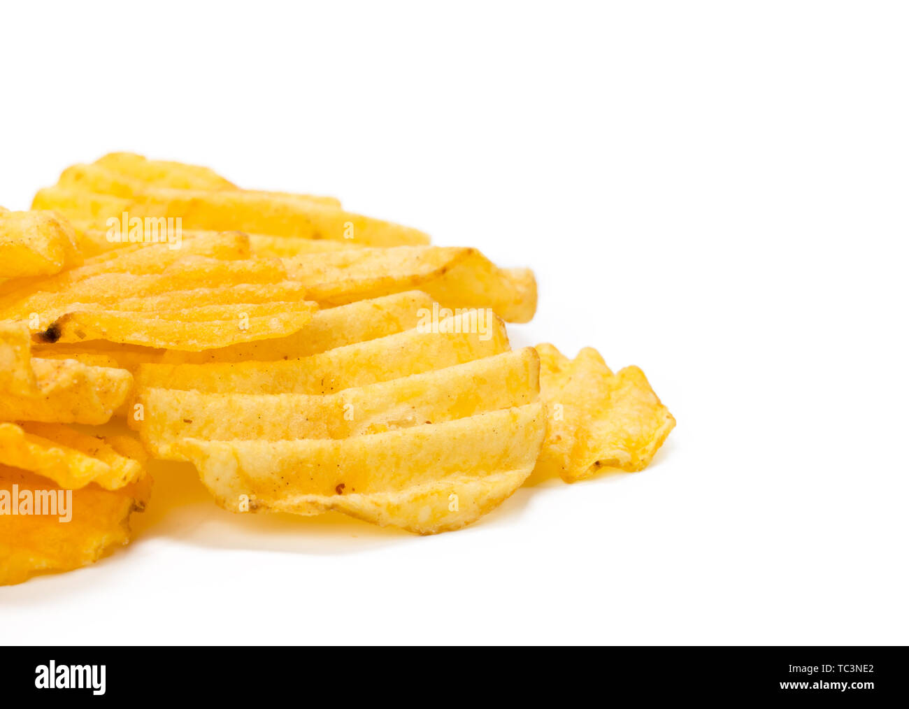 yellow potato chips isolated on white Stock Photo - Alamy
