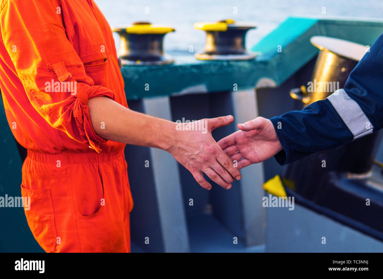 marine contractor businessman handshaking with worker on the ship Stock ...