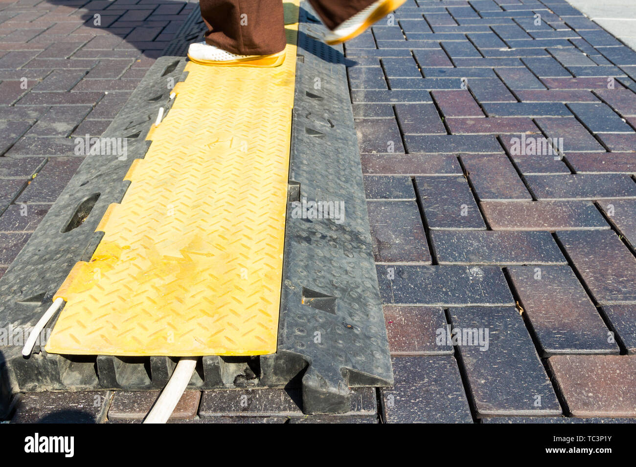 Outdoor cable protector or cable ramp Stock Photo - Alamy