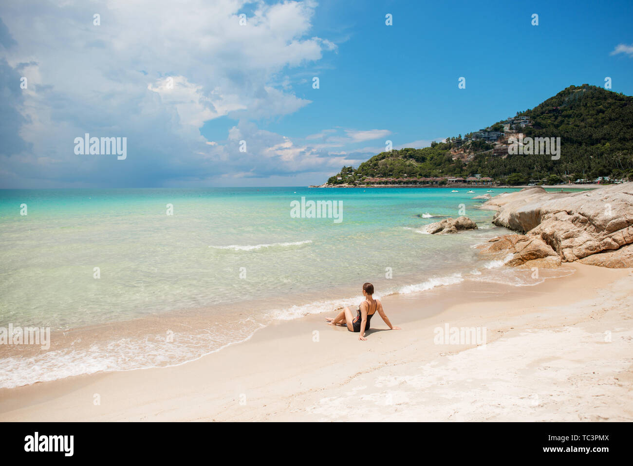 Woman bikini back sitting beach sea hi-res stock photography and images ...