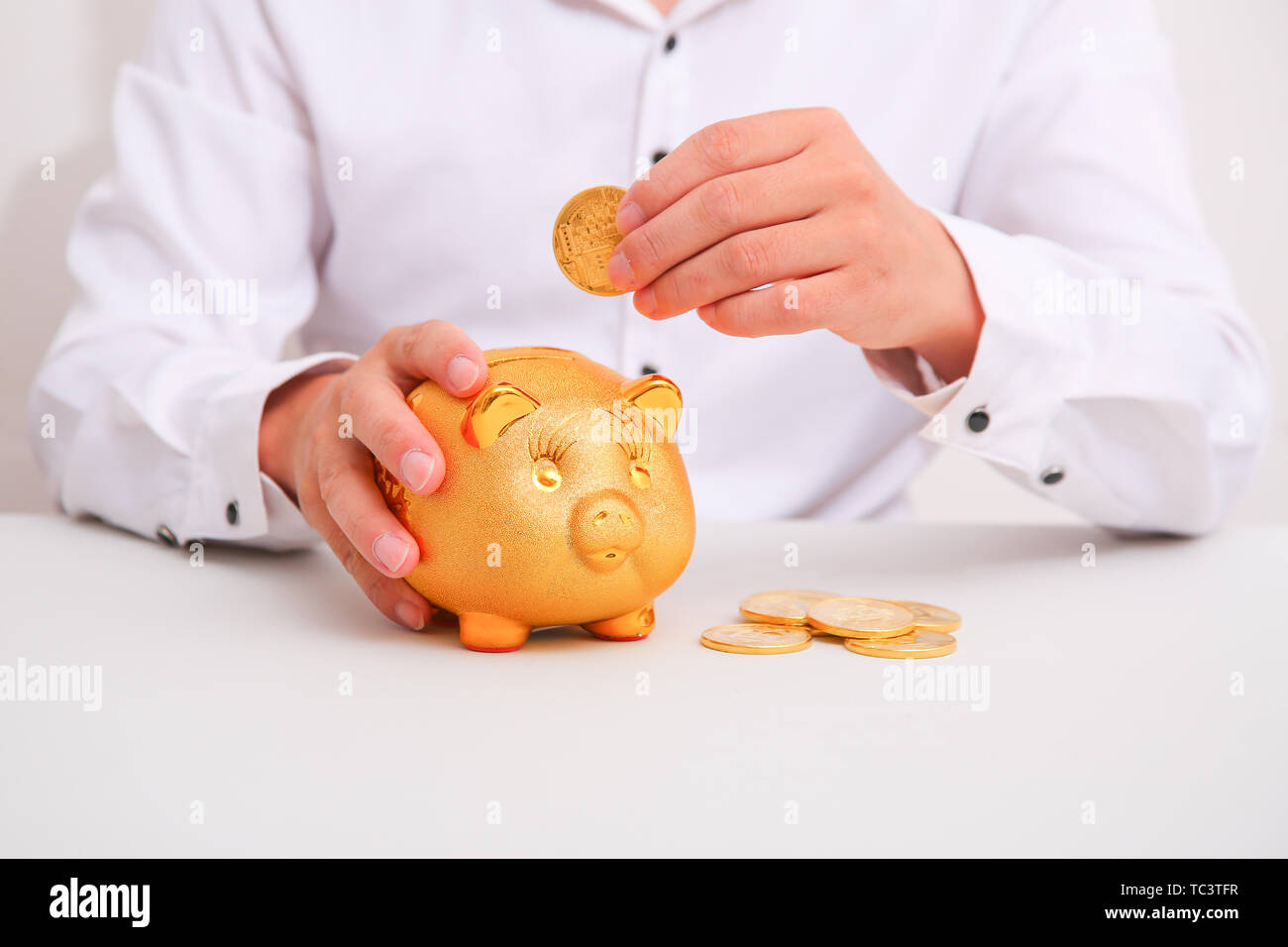 Savings pot gold coins Stock Photo - Alamy