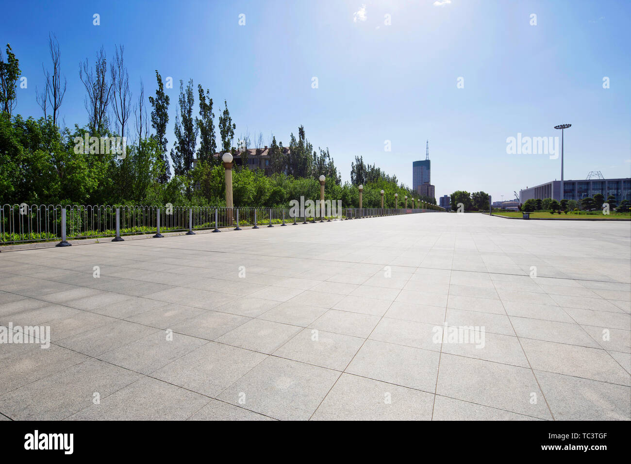 long empty footpath in modern city square with skyline Stock Photo - Alamy