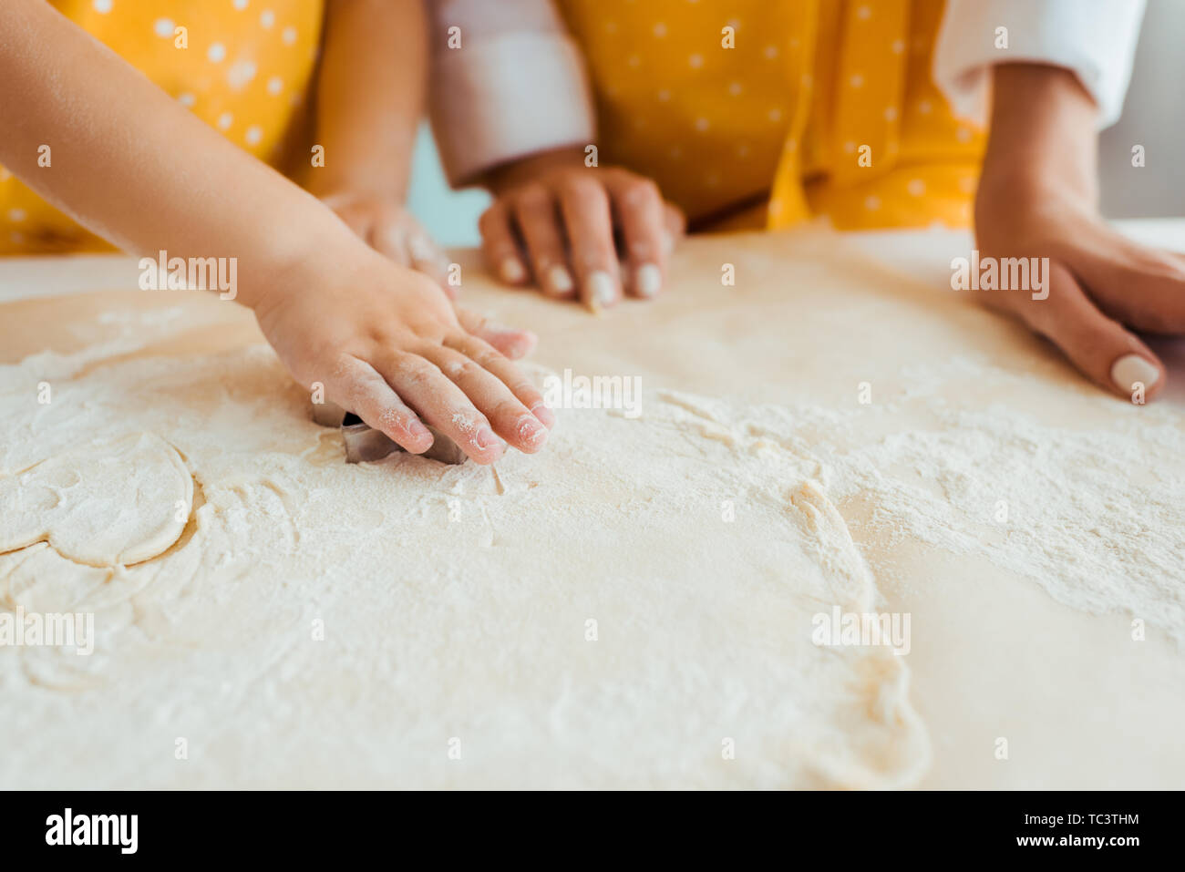 partial view of daughter using heart shaped dough mold Stock Photo - Alamy
