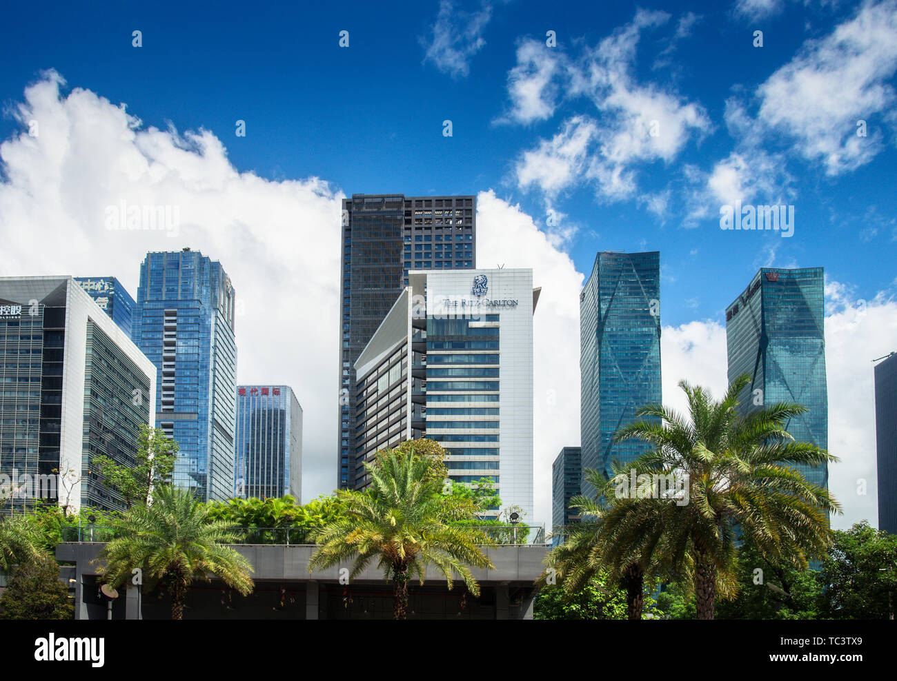 High rise modern glass office block buildings reflecting clouds hi-res ...