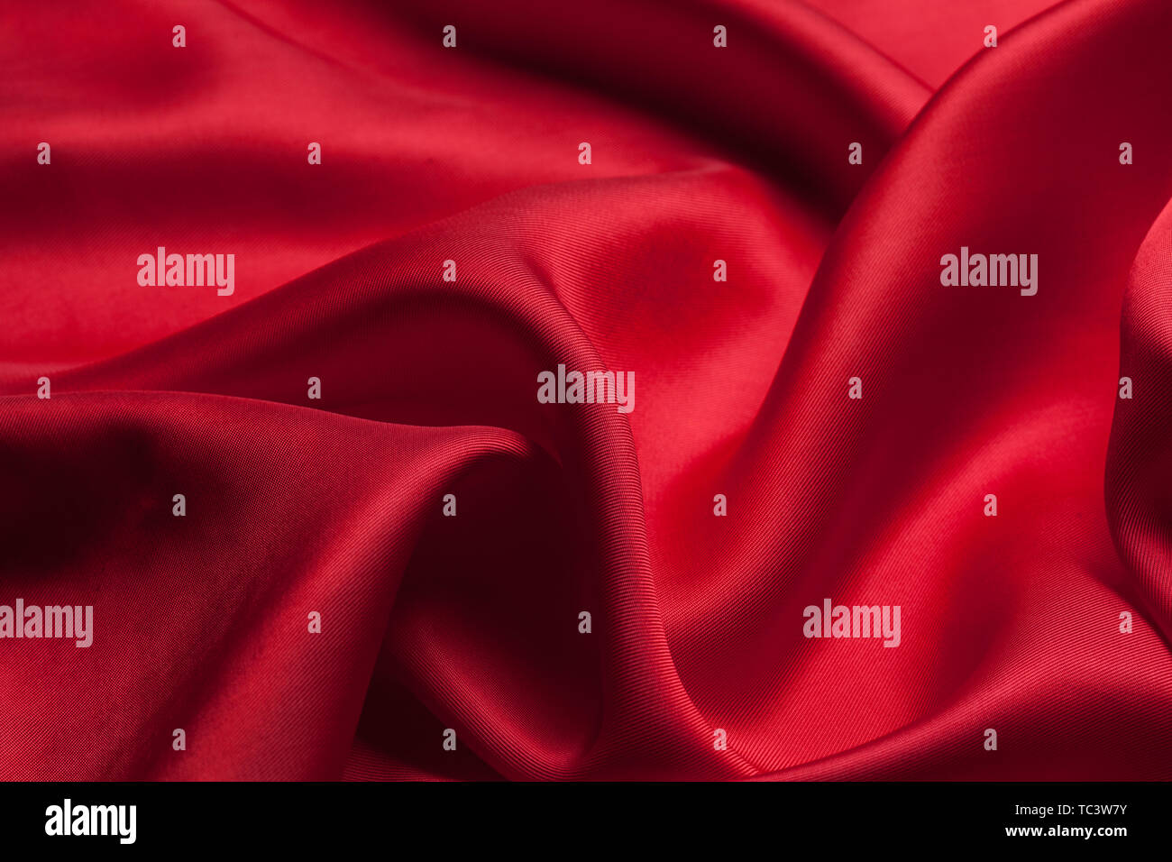 Red cloth waves background texture Stock Photo - Alamy
