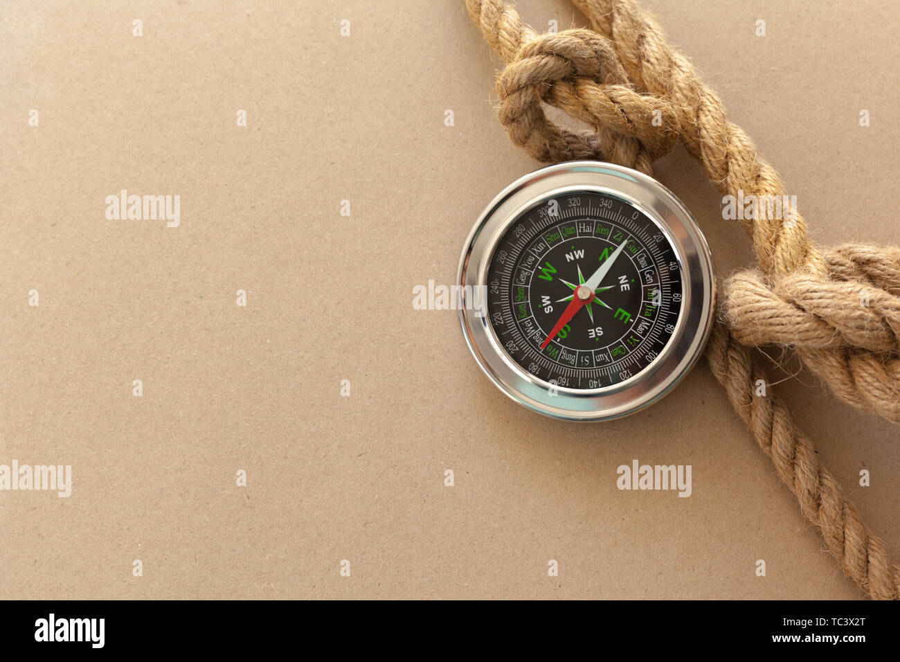 ship ropes and compass Stock Photo - Alamy