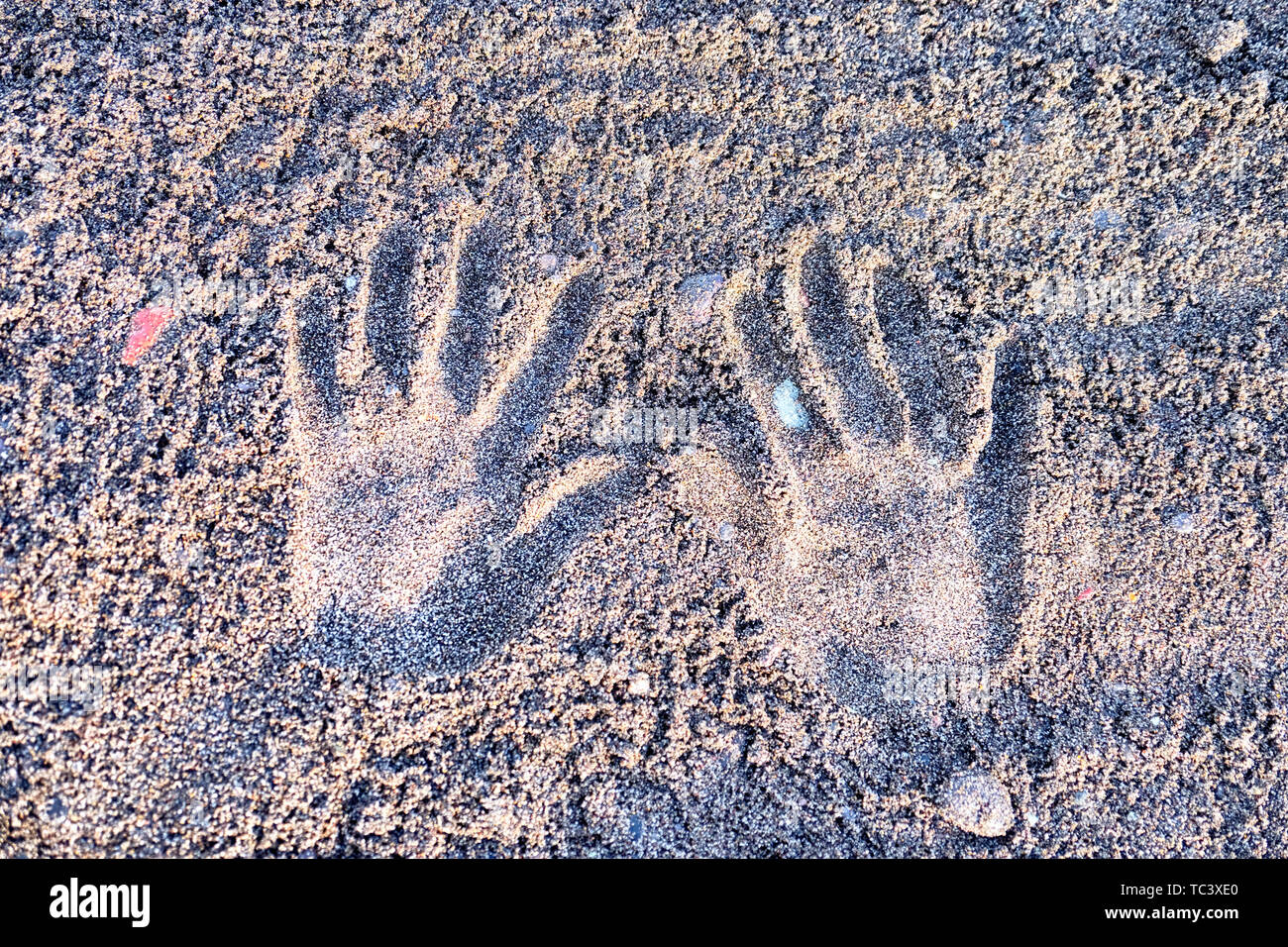 Human palm prints on beach sand Stock Photo - Alamy