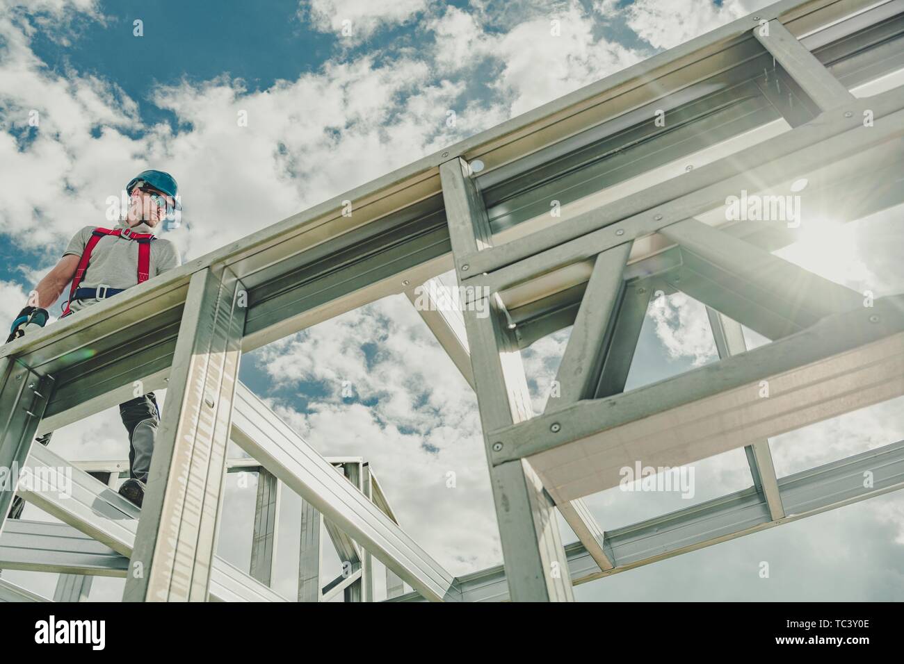 Skeleton Steel Construction. Caucasian Contractor with Power Tool in a ...
