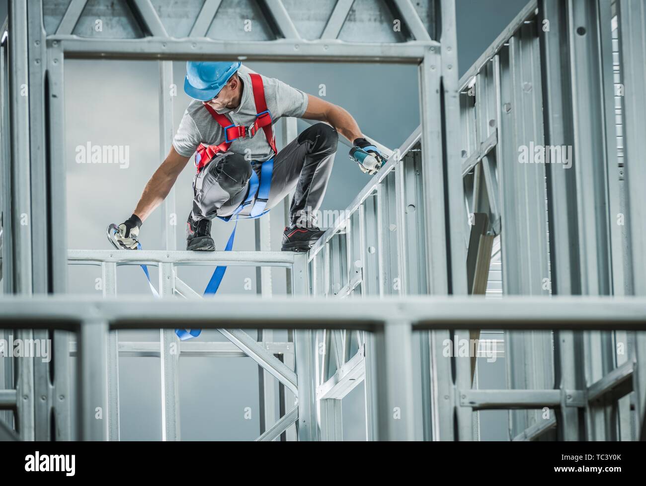 Caucasian Contractor Building Skeleton Steel Frame with Help of Safety ...