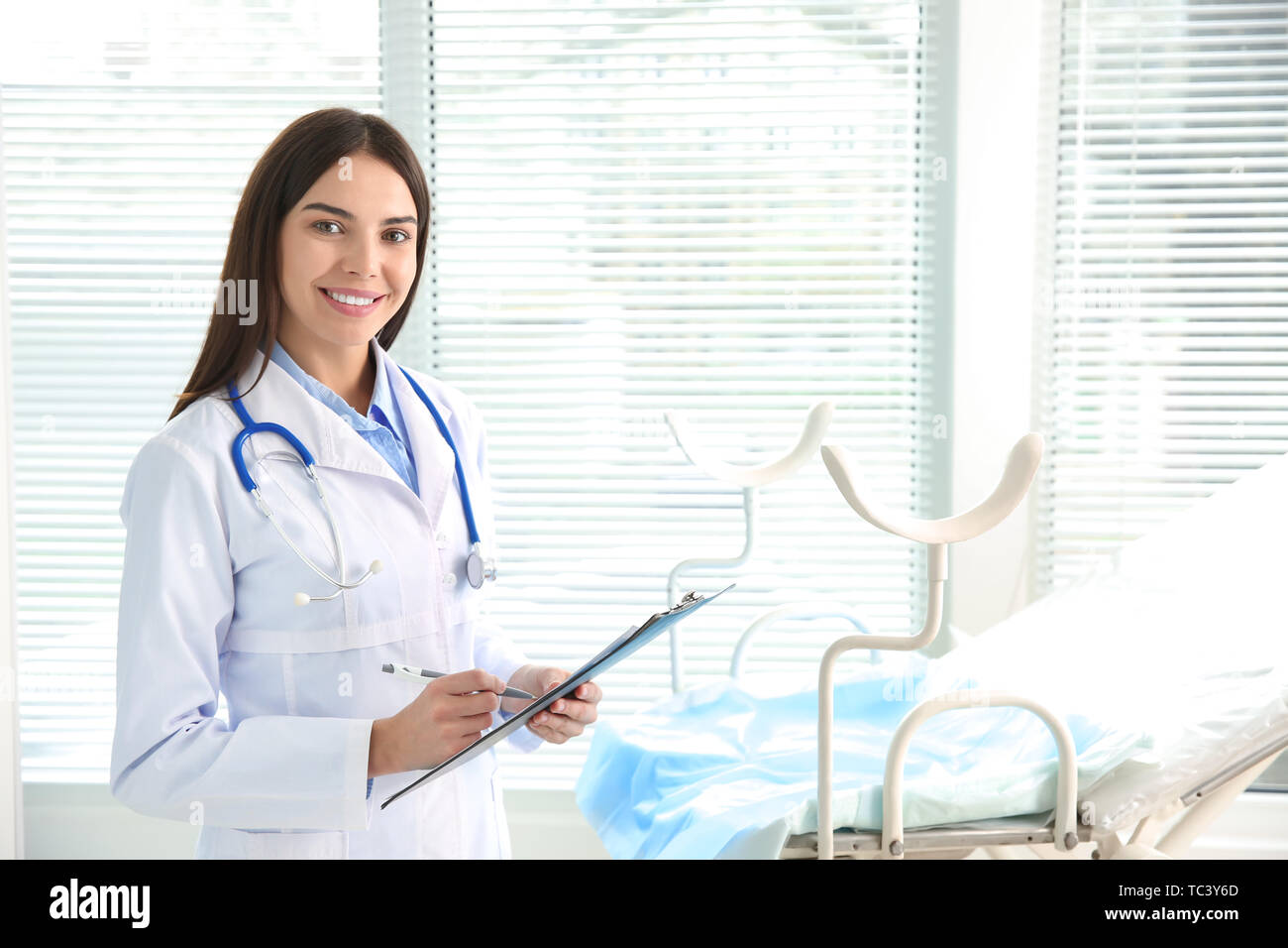 Beautiful female gynecologist in clinic Stock Photo - Alamy