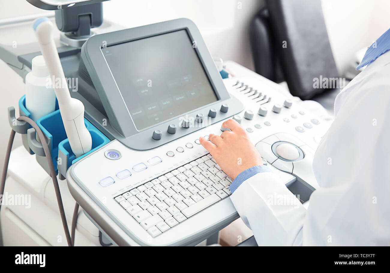 Female ultrasonographer working in modern clinic Stock Photo - Alamy