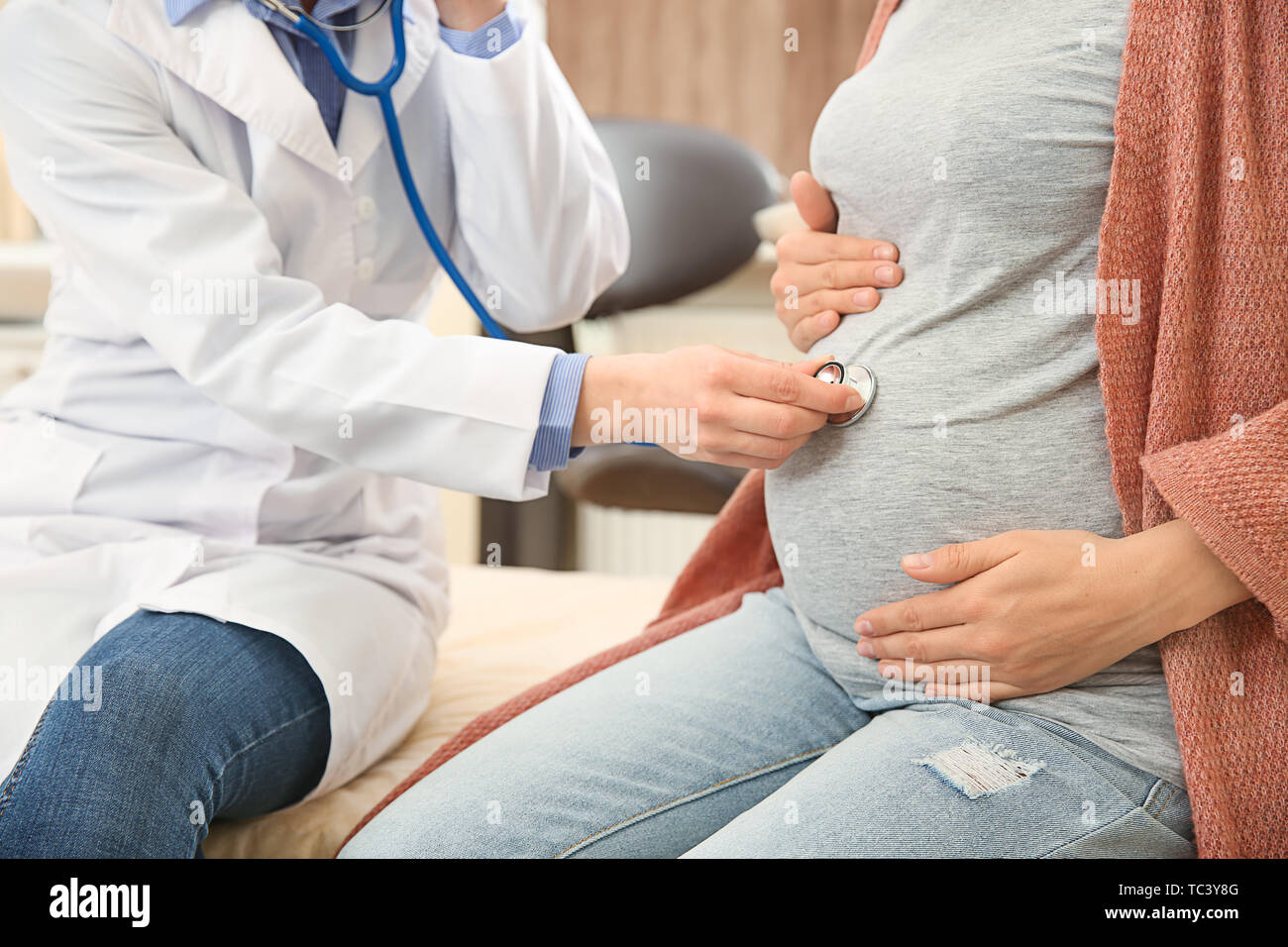 Female gynecologist working with pregnant woman in clinic Stock Photo ...