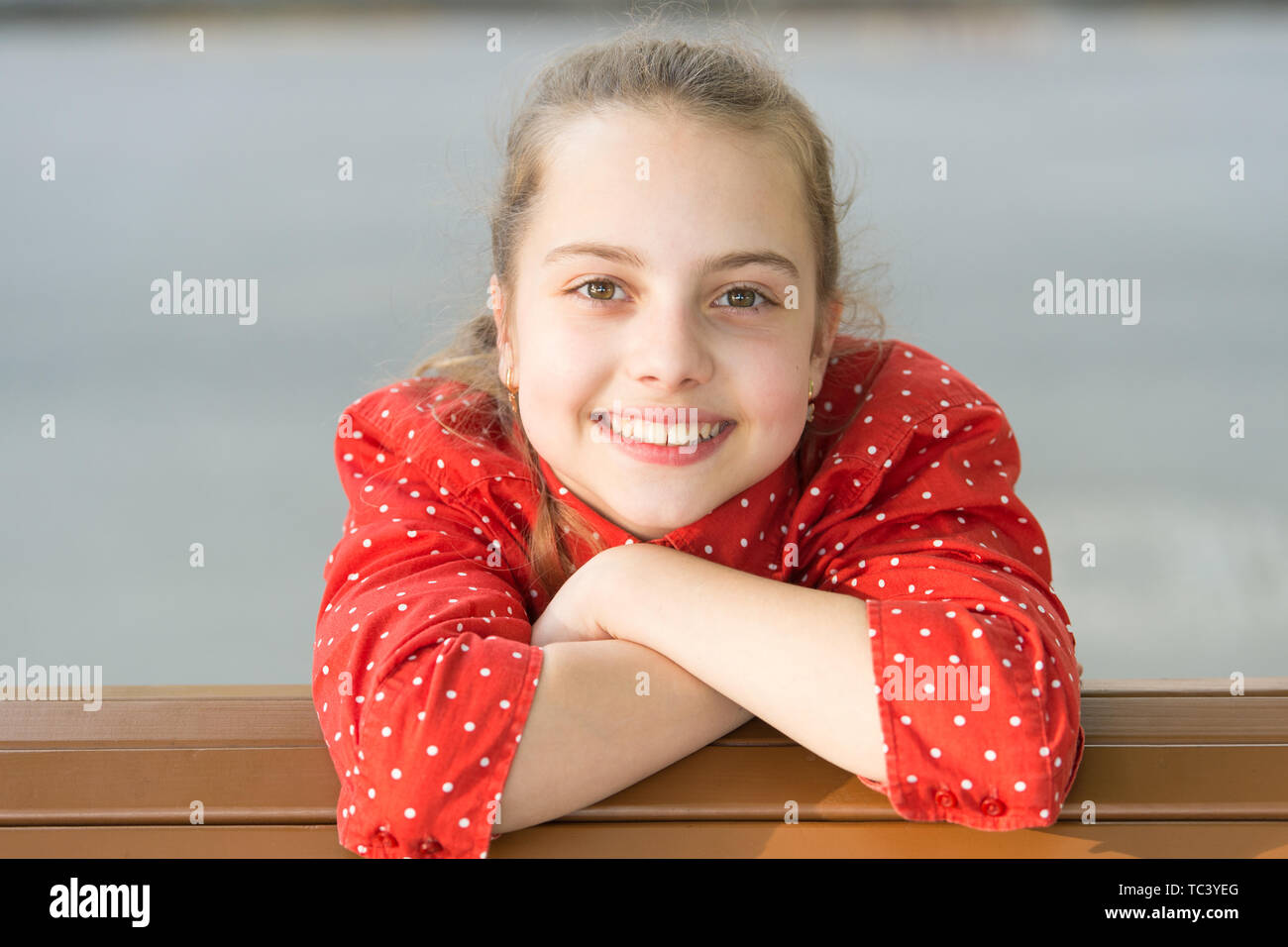 Experiencing the perfect skin. Happy little girl enjoying smooth baby ...