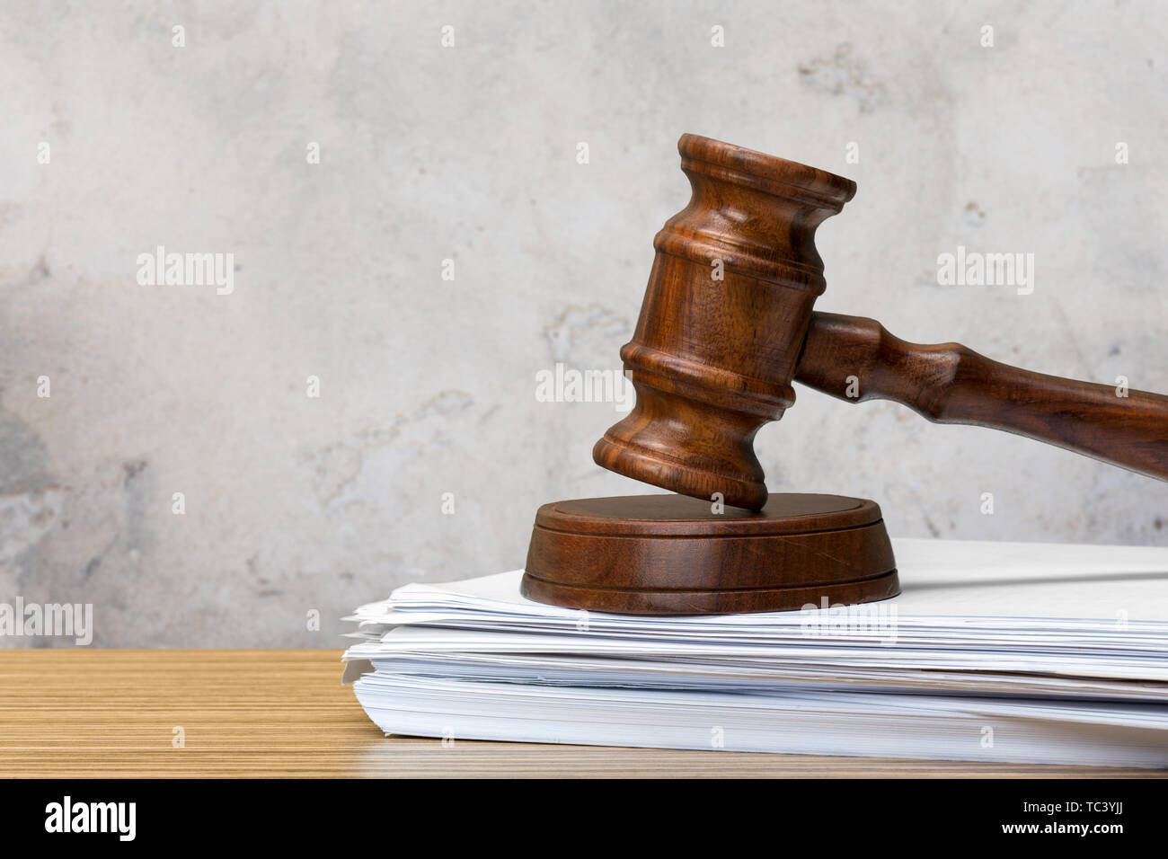 judge hammer on white paper and table Stock Photo - Alamy