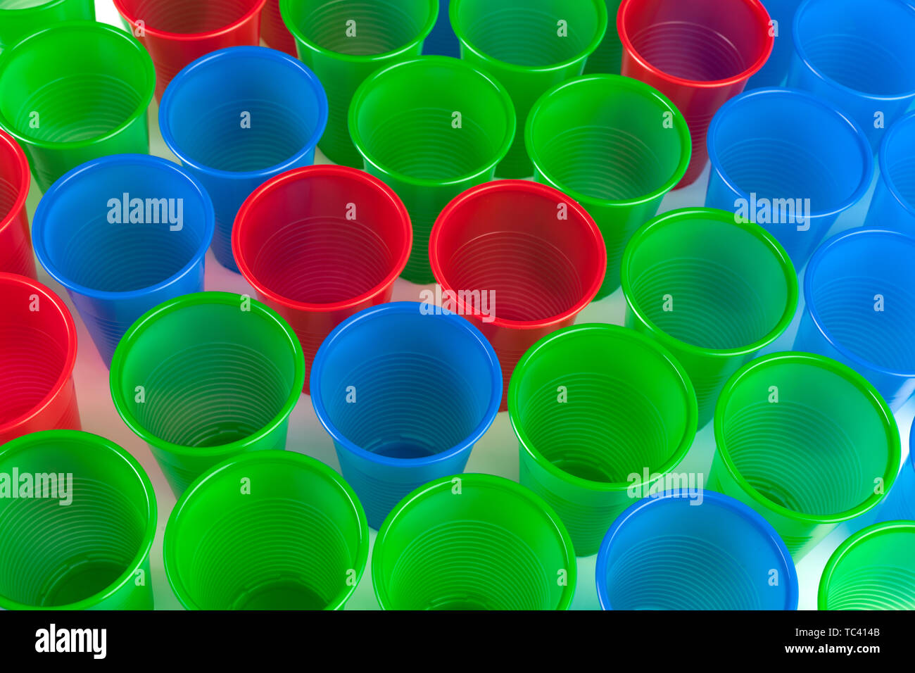 Multicolor plastic glasses isolated on white background Stock Photo - Alamy