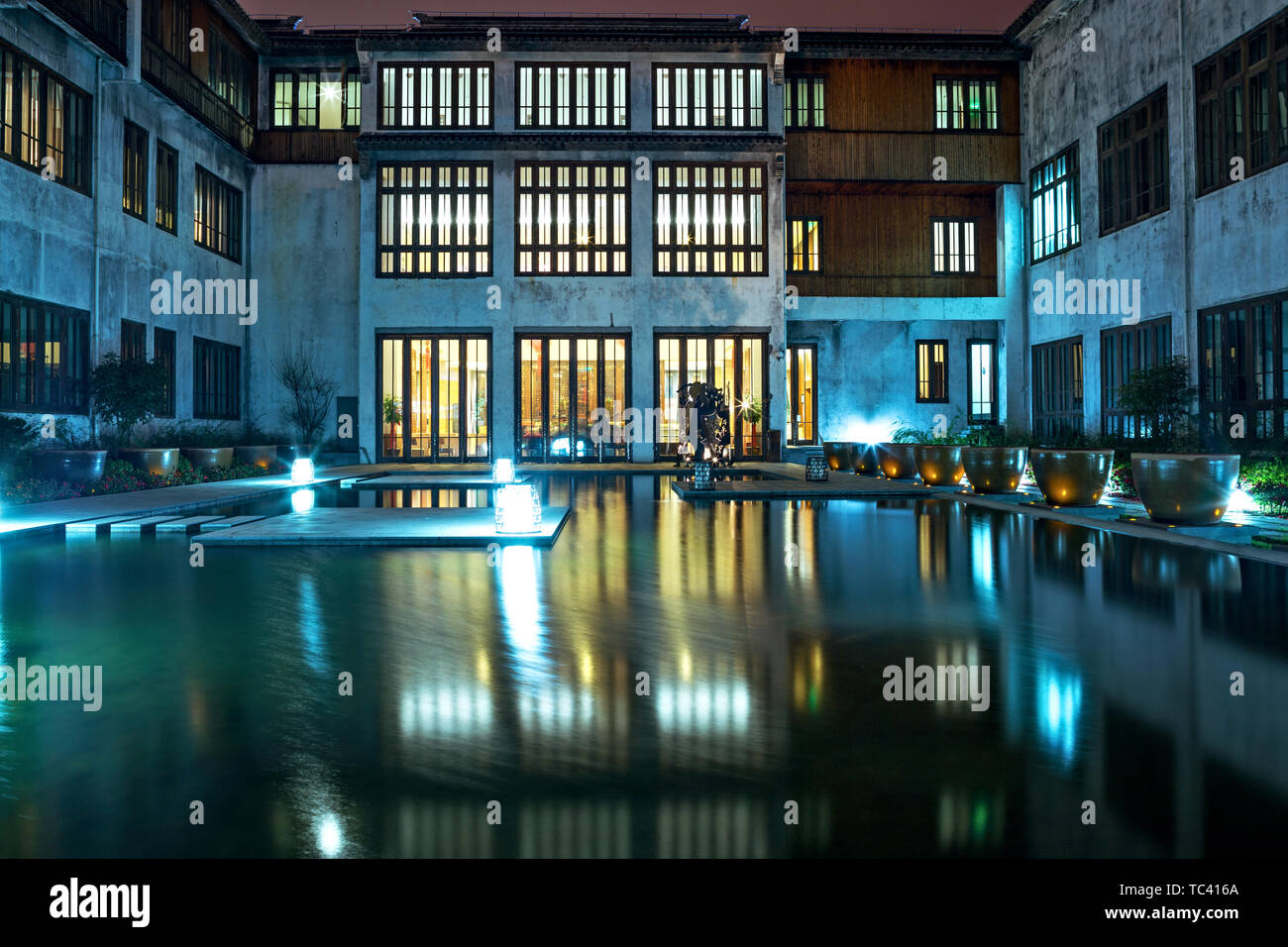 Night scene of traditional building near the river Stock Photo - Alamy