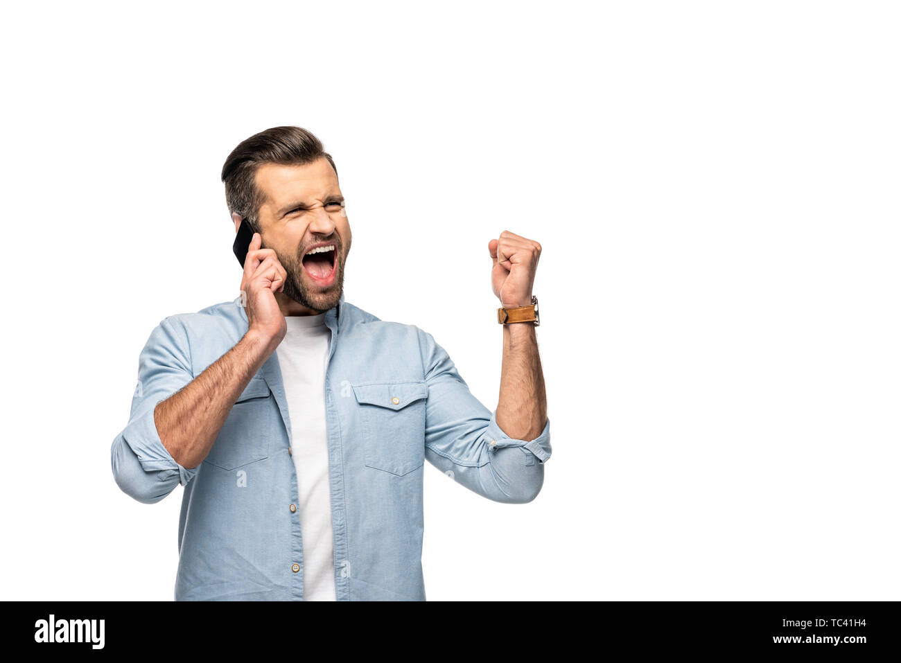 excited man with clenched fist talking on smartphone Isolated On White ...
