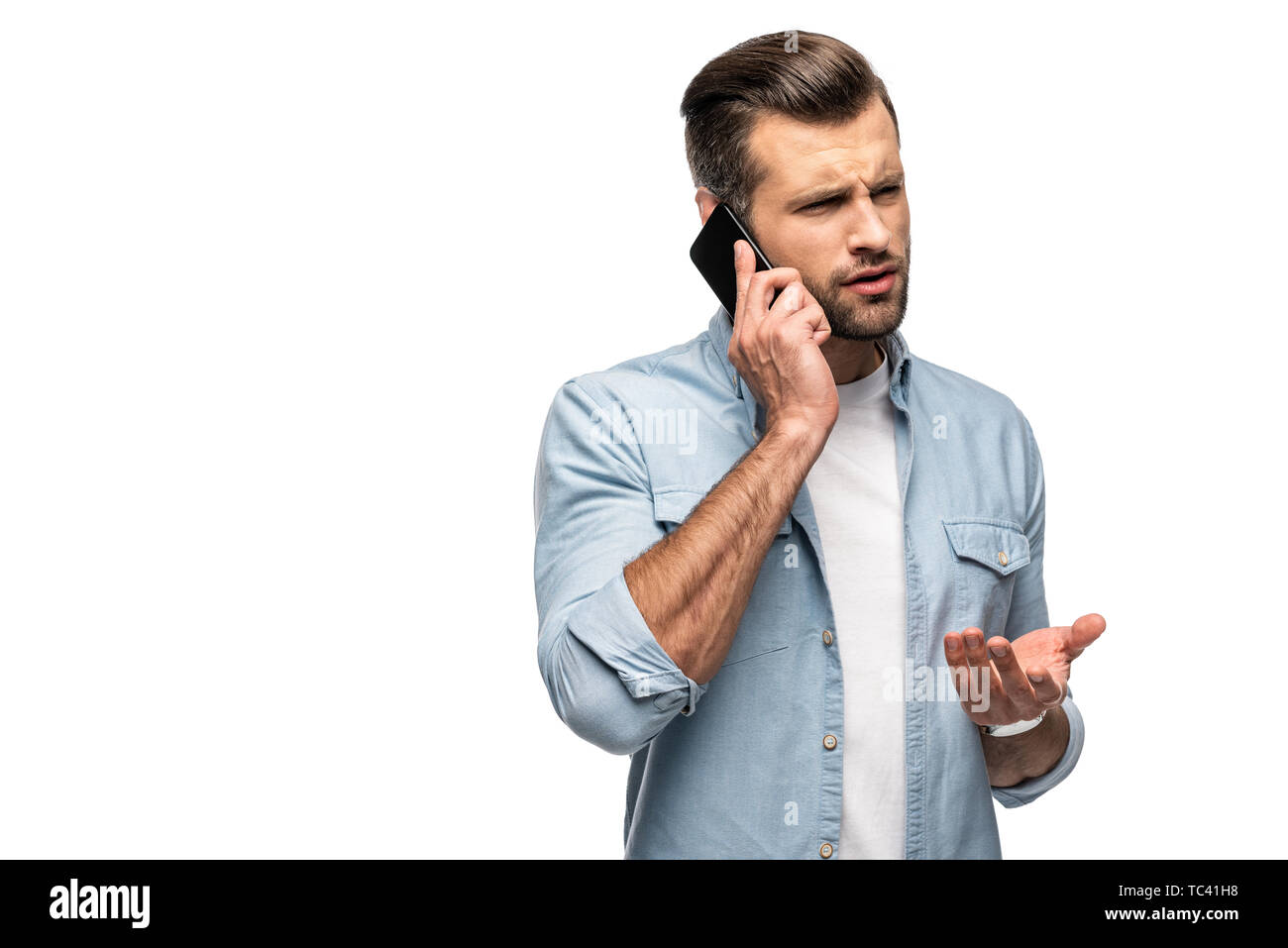confused man talking on smartphone and gesturing Isolated On White ...