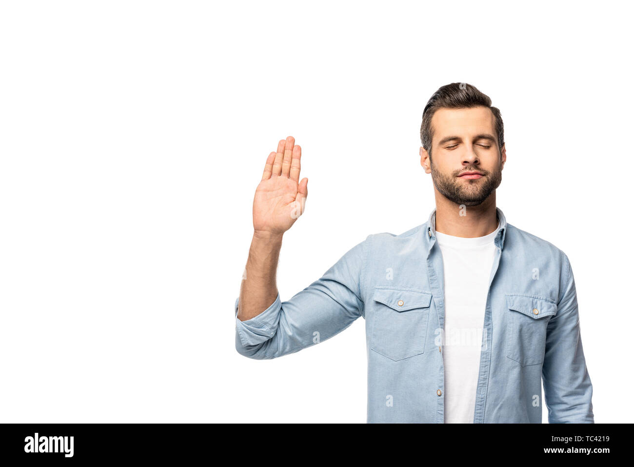 man with raised hand and closed eyes Isolated On White with copy space ...