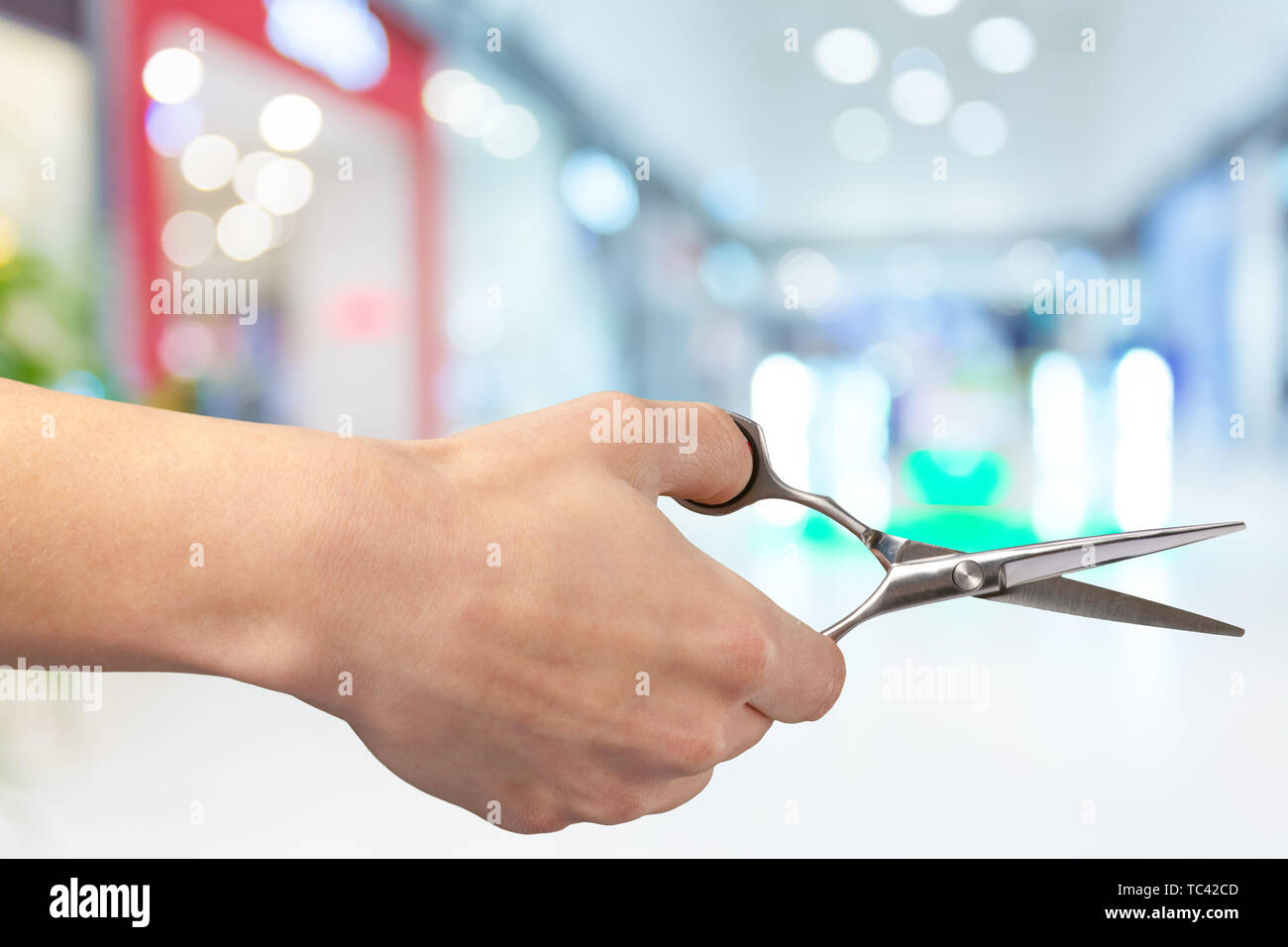 woman's hand holding scissors Stock Photo - Alamy