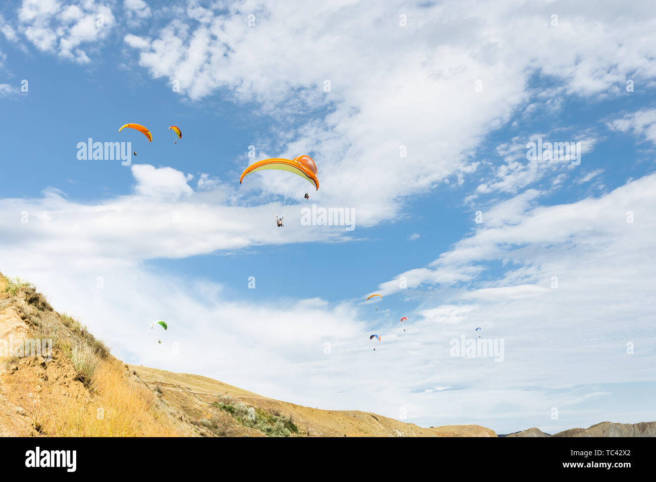 paraplane flying high up Stock Photo - Alamy