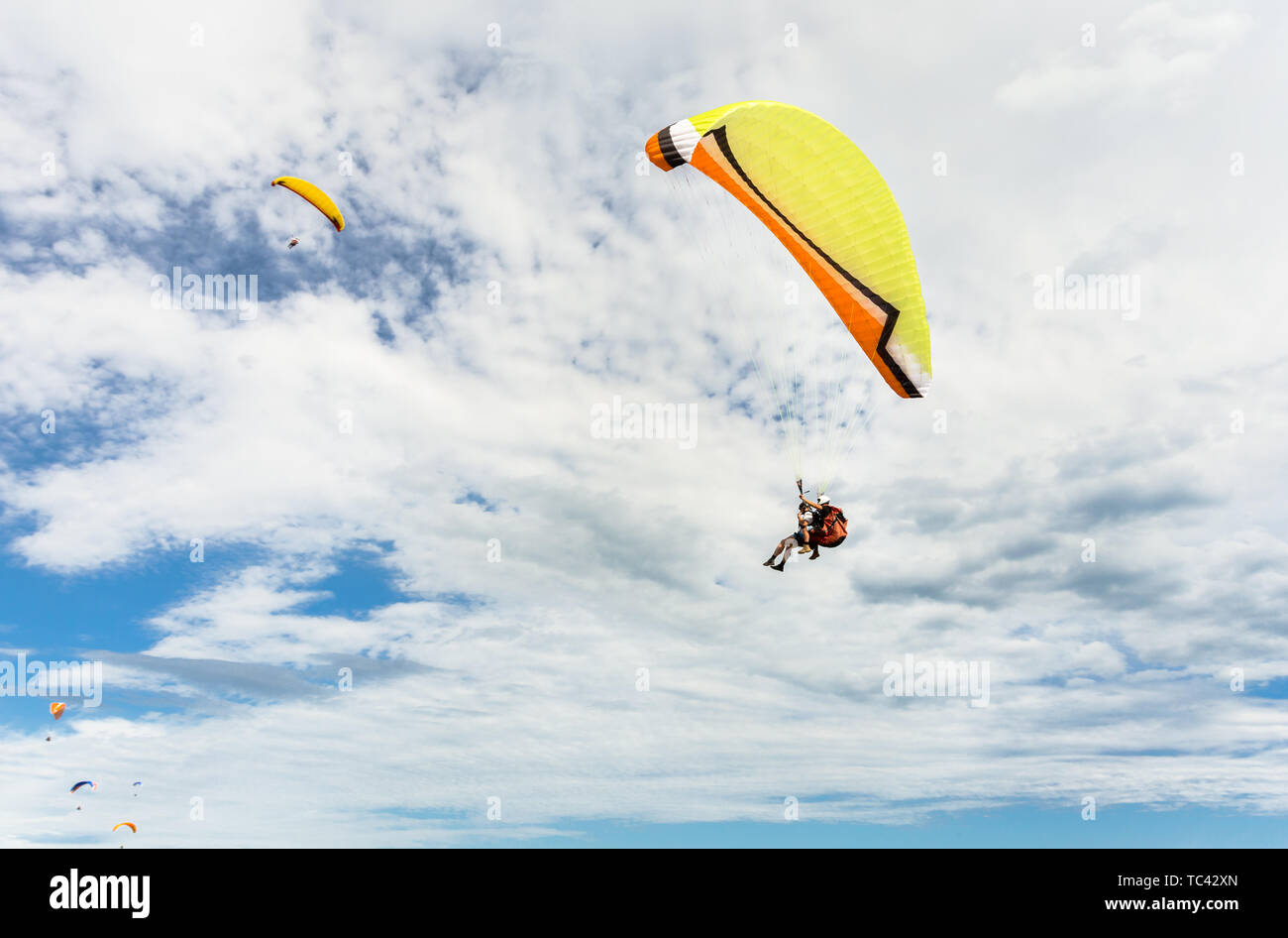 paraplane flying high up Stock Photo - Alamy