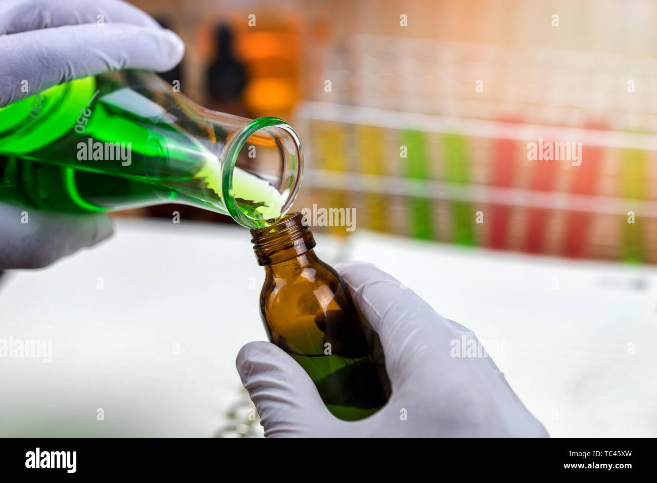 Pouring chemicals hi-res stock photography and images - Alamy